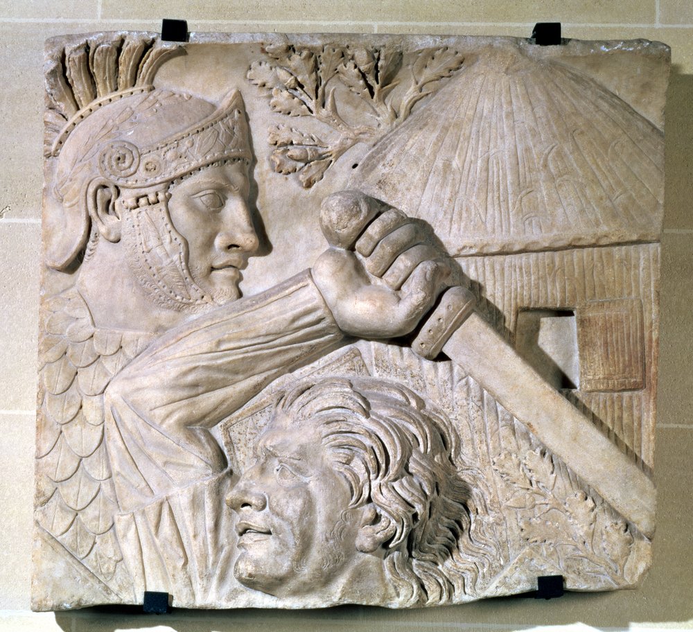 Relieve que representa a un bárbaro luchando contra un legionario romano